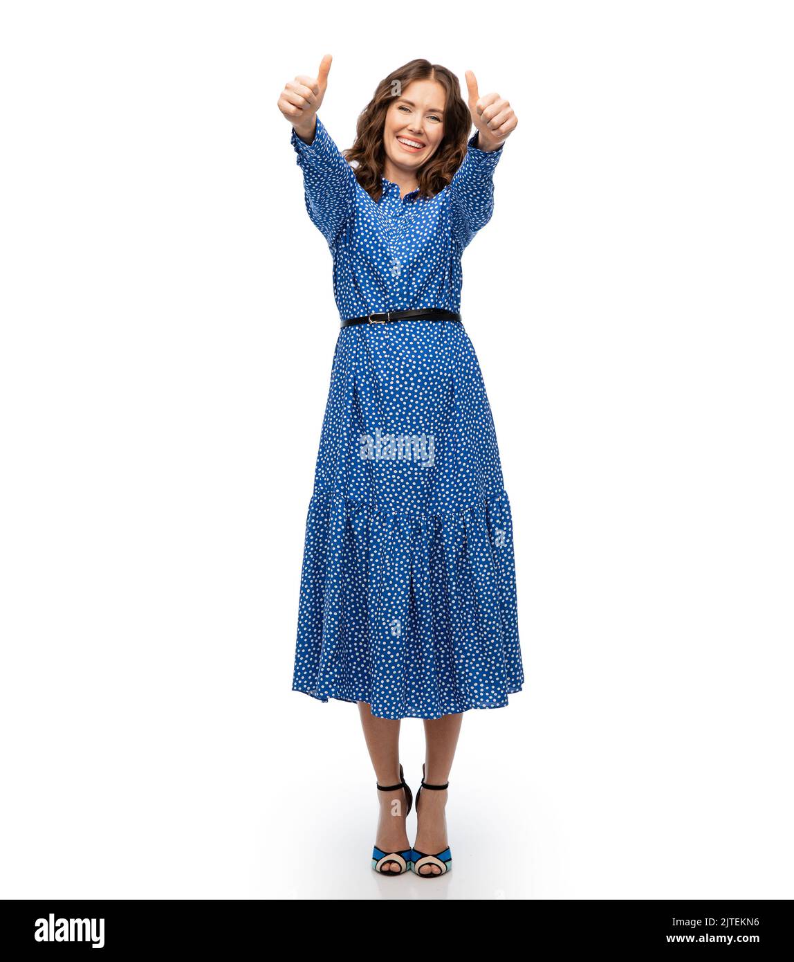 happy young woman in blue dress showing thumbs up Stock Photo - Alamy