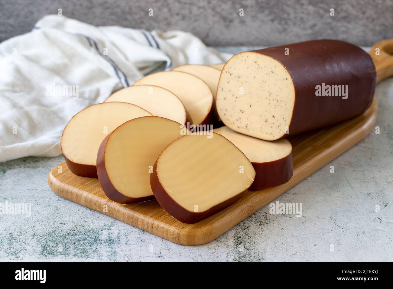 Smoked cheese. Dutch smoked cheese on stone background. close up Stock ...