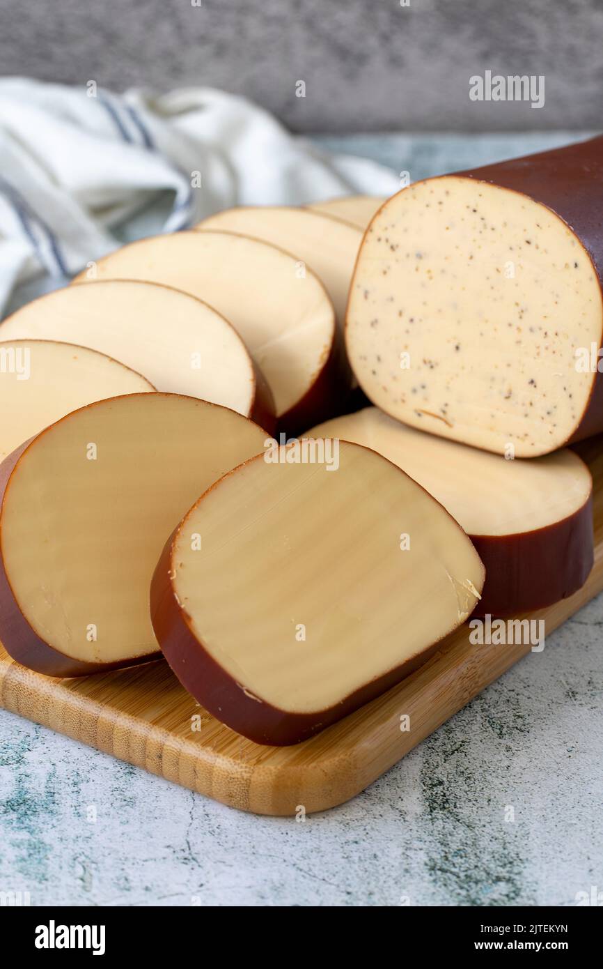 Smoked cheese. Dutch smoked cheese on stone background. close up Stock ...