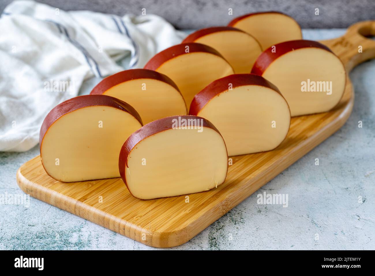 Smoked cheese. Dutch smoked cheese on stone background. close up Stock ...
