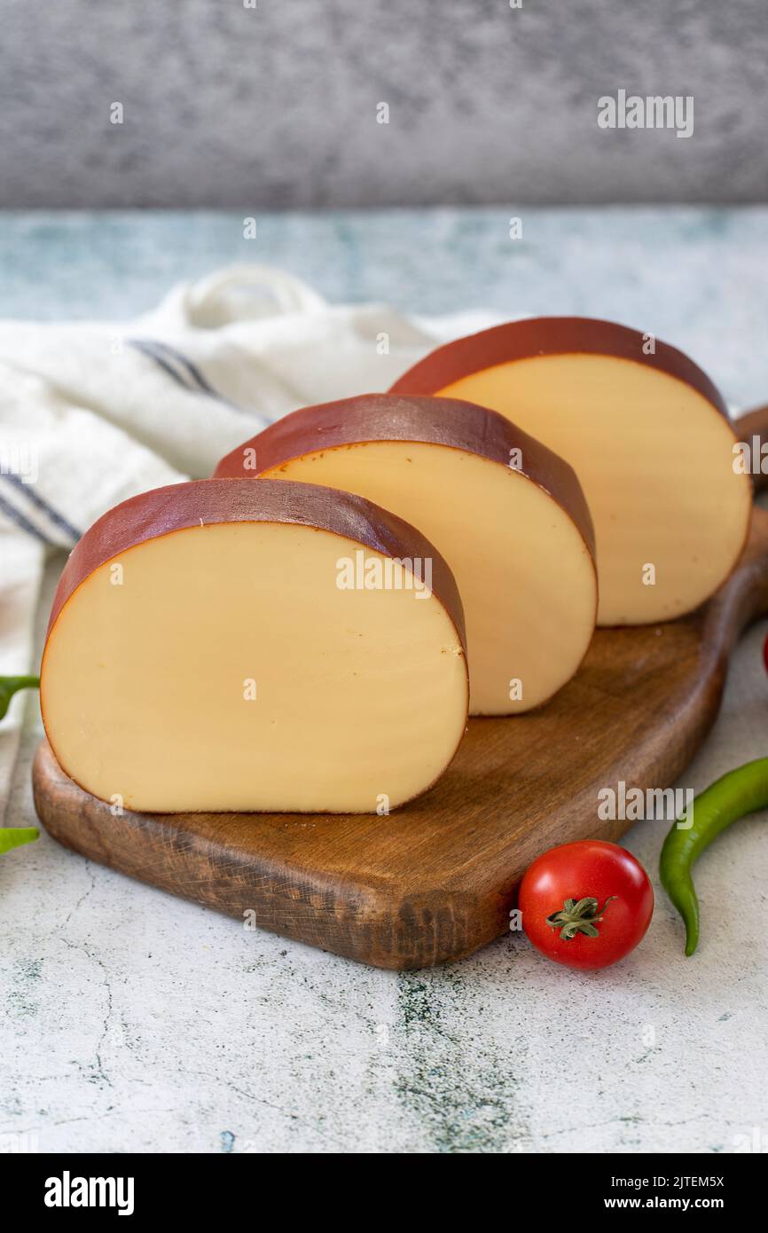 Smoked cheese. Dutch smoked cheese on stone background. close up Stock ...