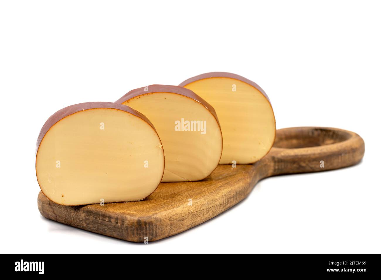 Smoked cheese. Dutch smoked cheese isolated on a white background ...