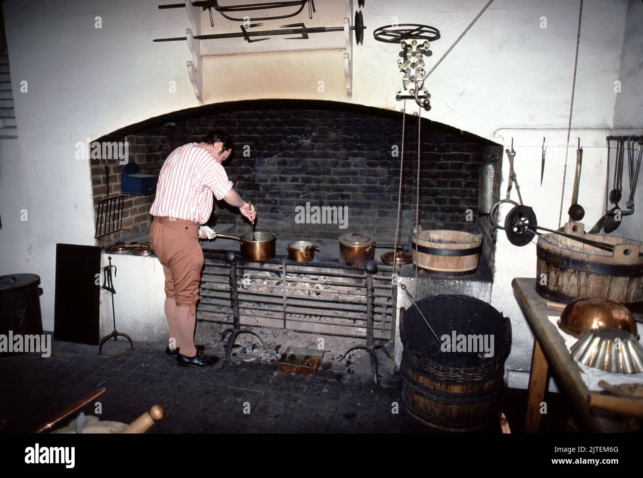 Williamsburg, VA. U.S.A. 9/1987. Gov. palace kitchen with docents ...