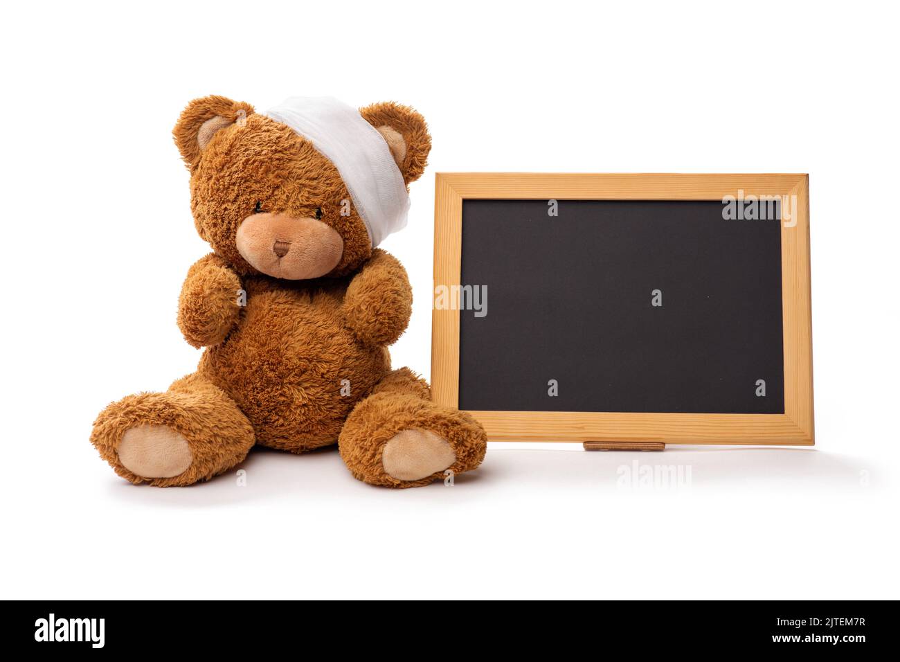 teddy bear toy with bandaged head and chalkboard Stock Photo - Alamy