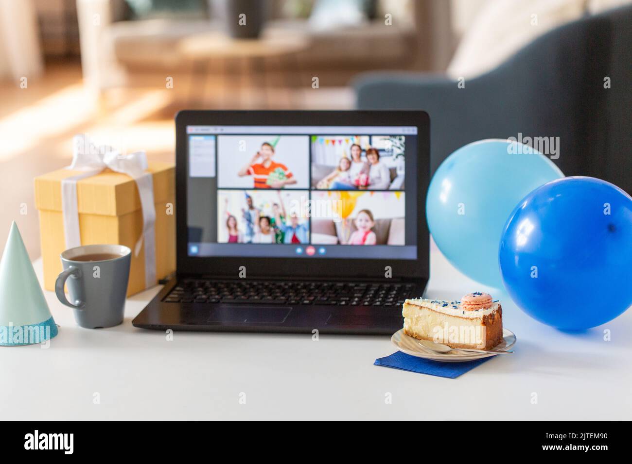 birthday cake and laptop with video call on screen Stock Photo - Alamy