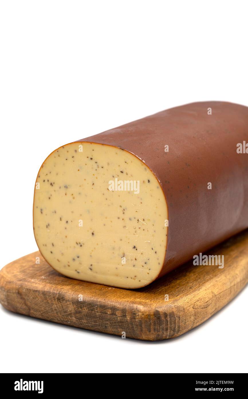 Black Pepper Smoked Cheese. Dutch smoked cheese isolated on a white ...