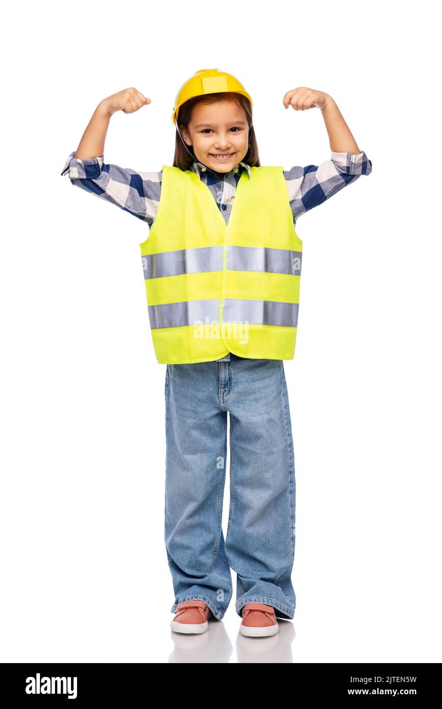 girl in helmet and safety vest showing power Stock Photo - Alamy