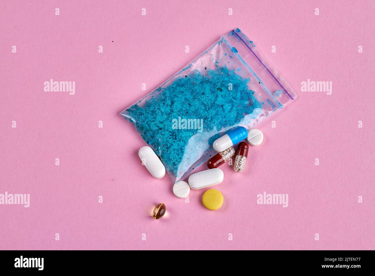 Top view various drugs isolated on pink background. Pills and tablets ...