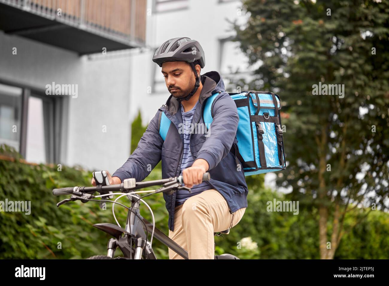 Man deliver bicycle hi-res stock photography and images - Alamy