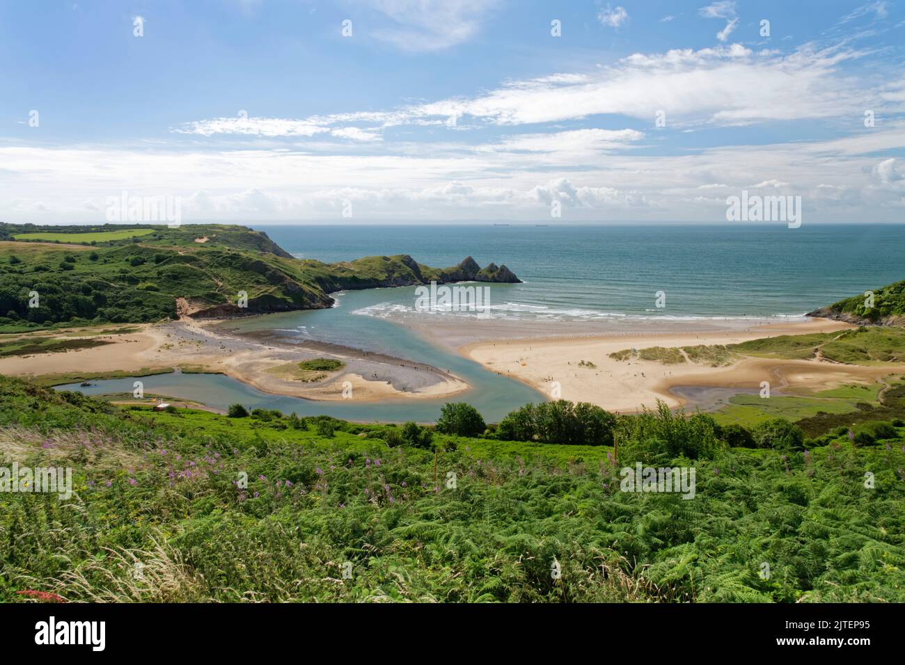 Overview of Three Cliffs Bay with Pennard Pill stream flowing across ...