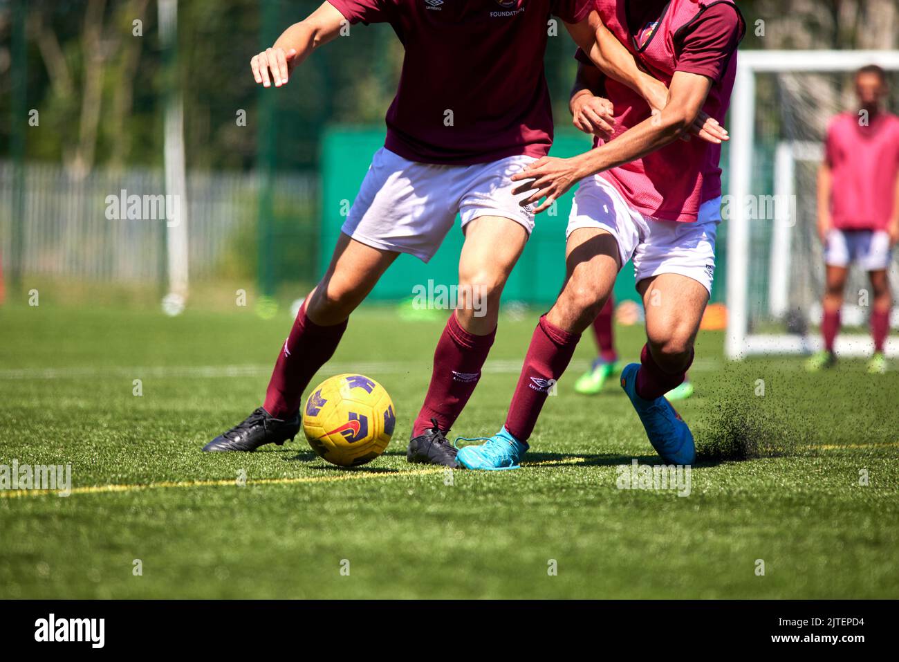 Football skills children playing on astro turf pitches Stock Photo - Alamy