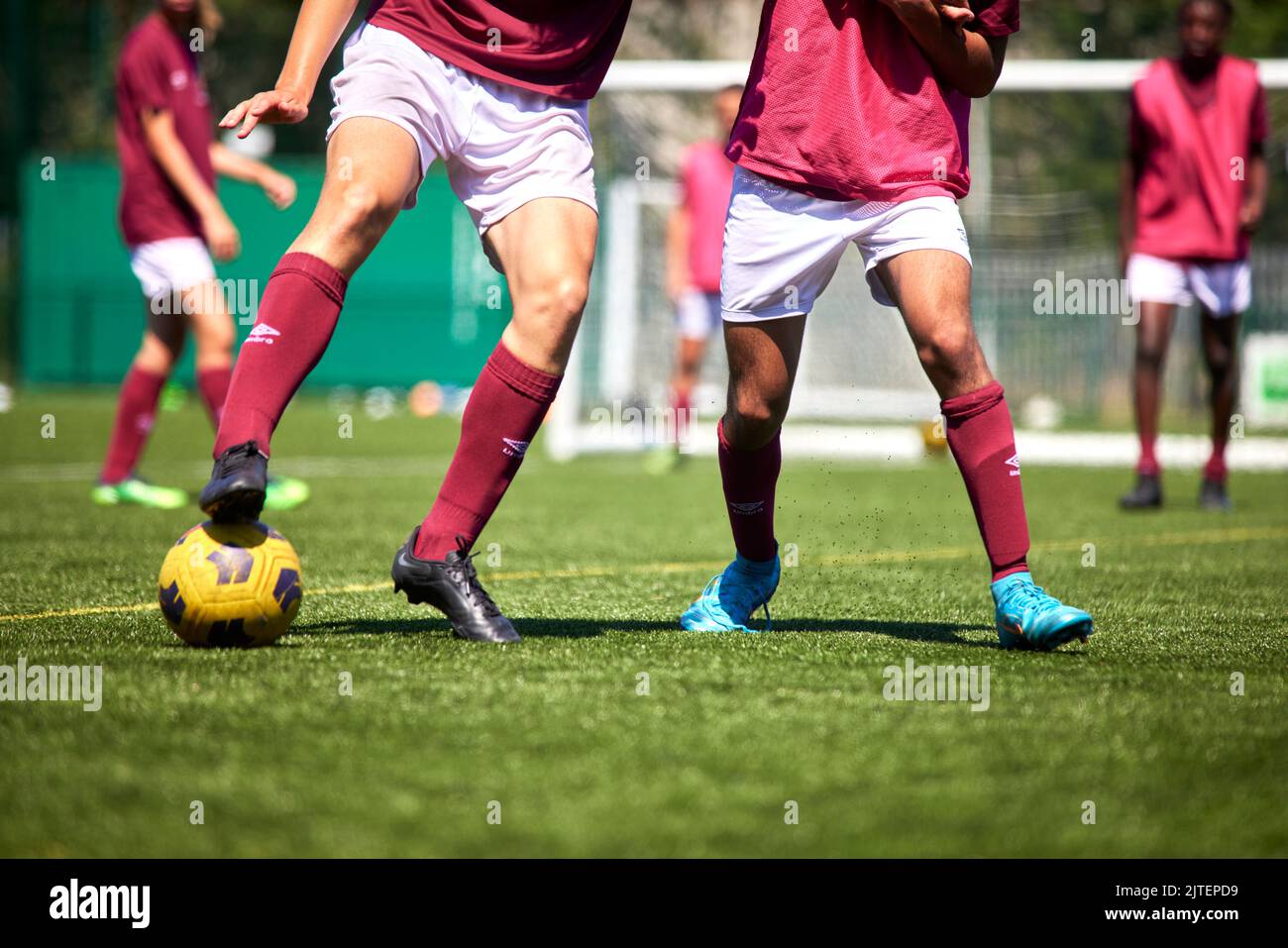 Football skills children playing on astro turf pitches Stock Photo - Alamy