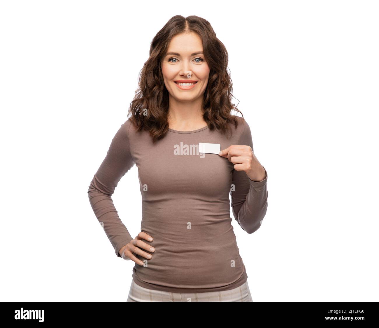 happy female shop assistant showing her name tag Stock Photo - Alamy
