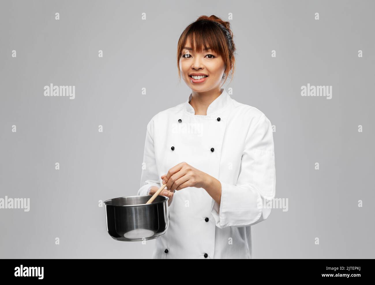 Happy smiling female chef hi-res stock photography and images - Alamy