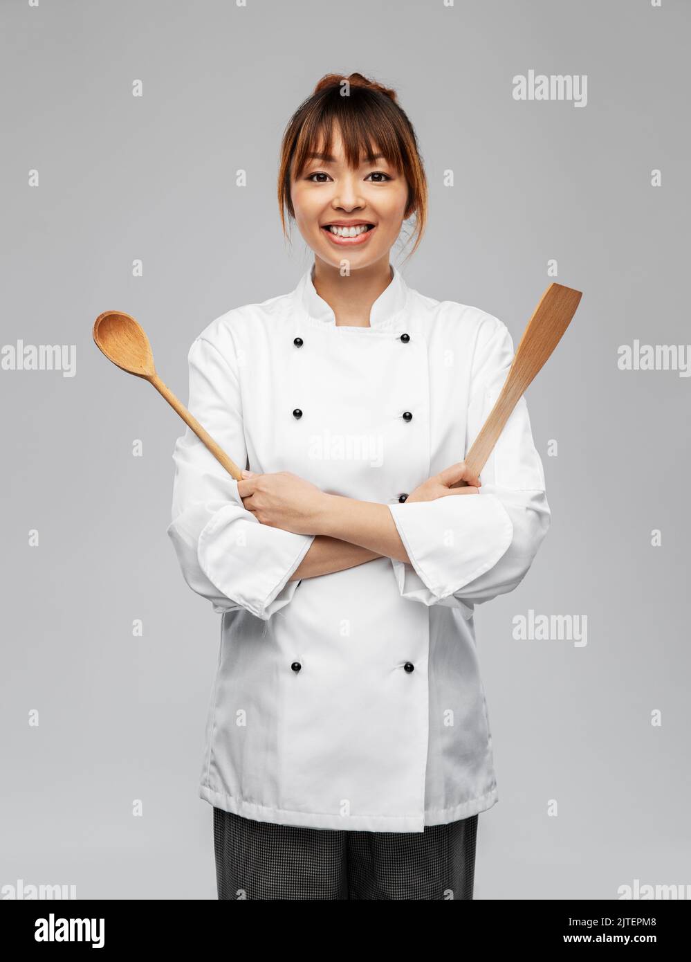 happy smiling female chef with wooden spoon Stock Photo - Alamy