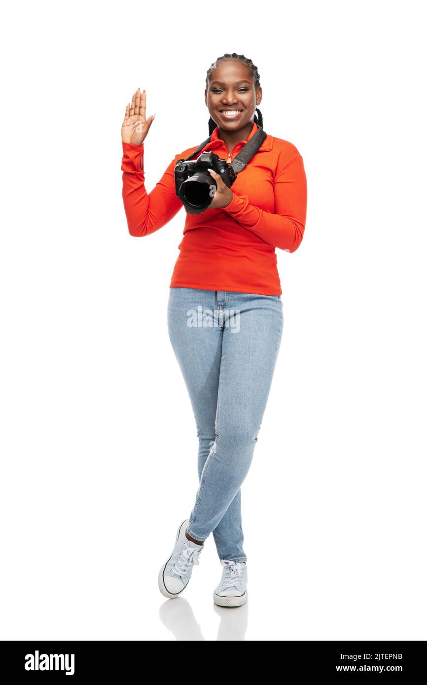 Happy african woman waving hand Cut Out Stock Images & Pictures - Alamy