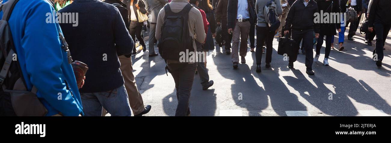 crowd of commuters walking on a street Stock Photo - Alamy