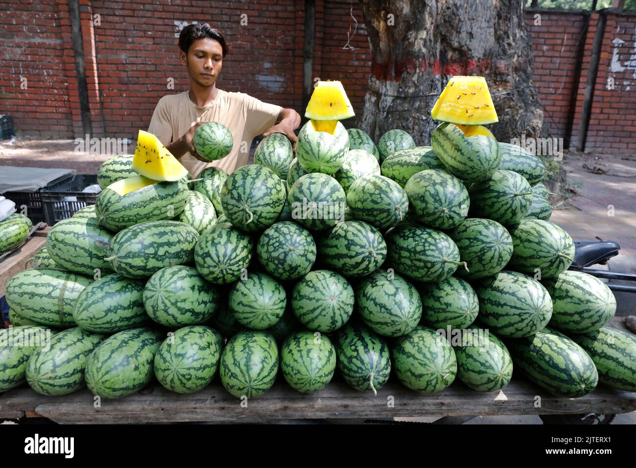 Dhaka, Bangladesh - August 30, 2022: In the sweltering heat, yellow ...
