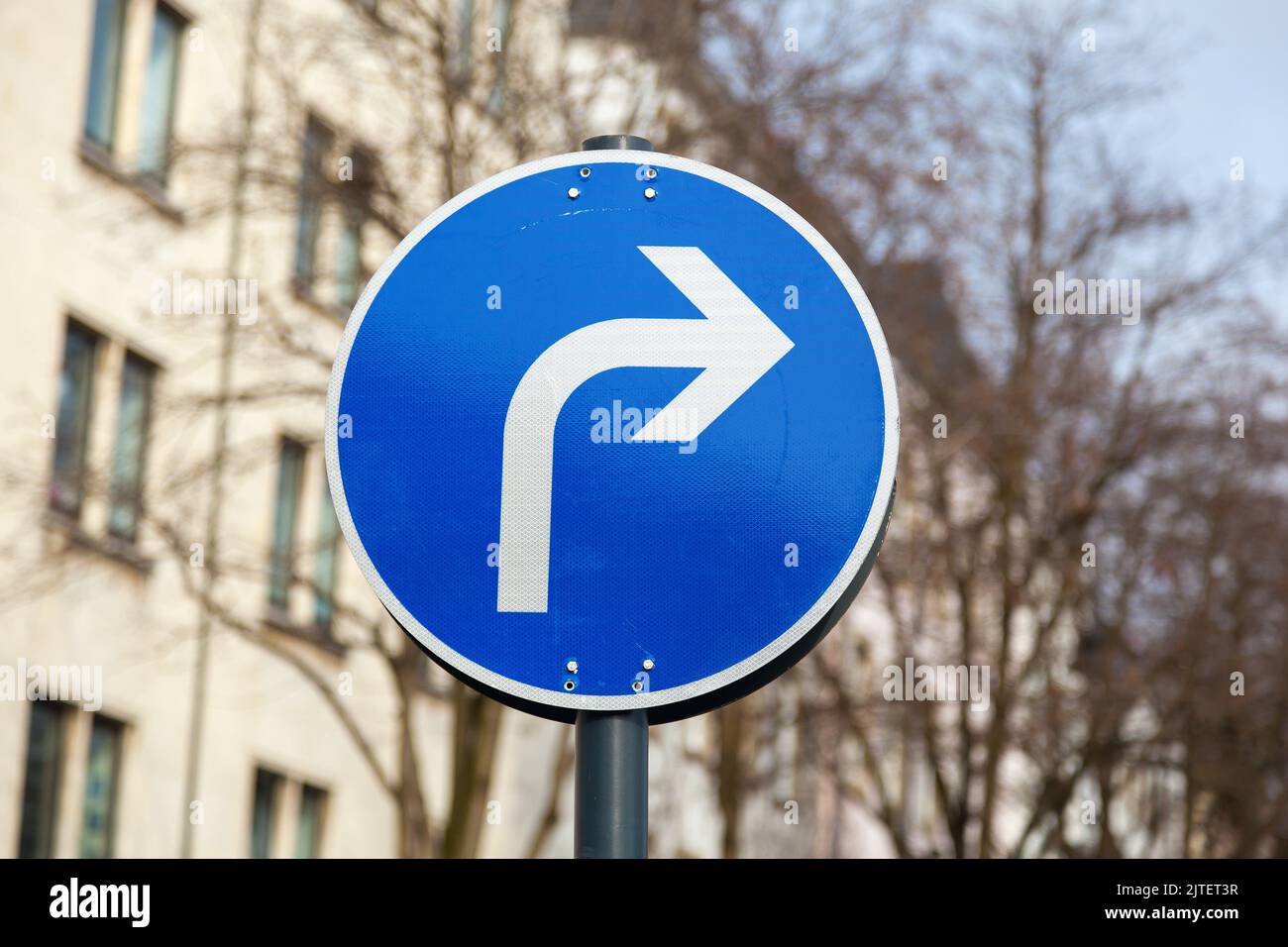 right turning traffic sign in a city street Stock Photo - Alamy