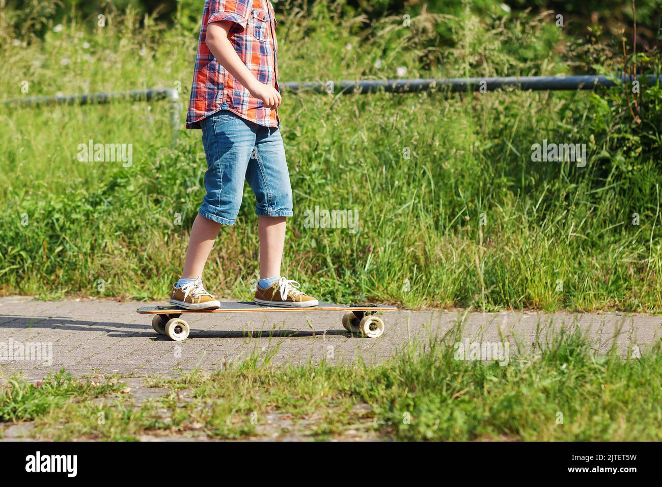 young boy on a skateboard Stock Photo - Alamy