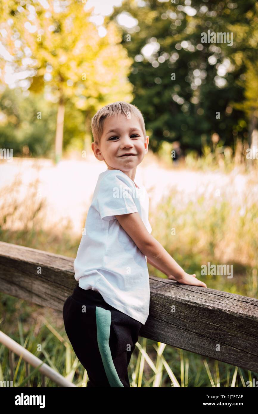 Child near pond hi-res stock photography and images - Alamy