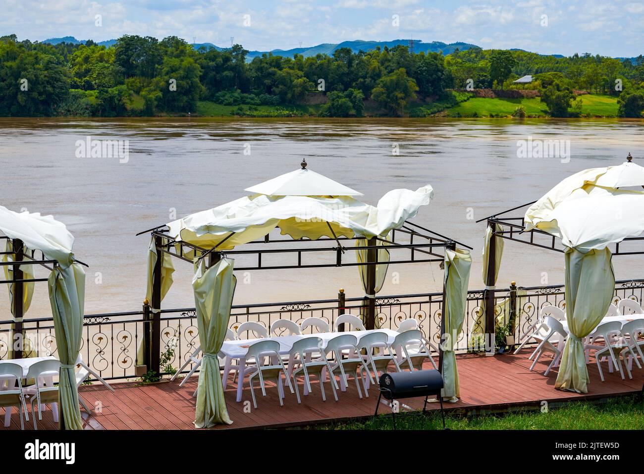 Dining table and chairs for outdoor riverside banquets Stock Photo - Alamy