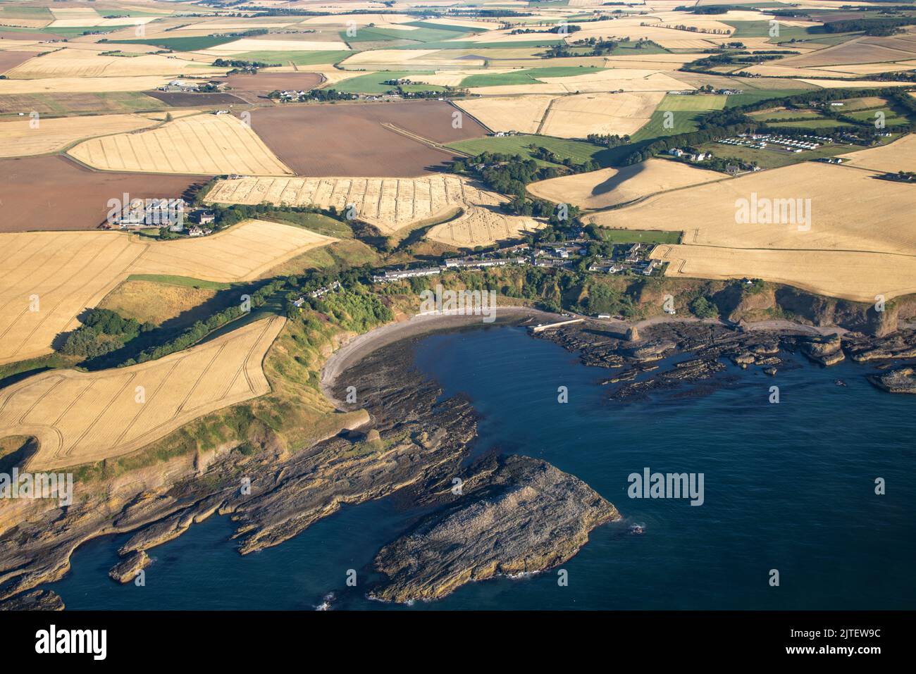 Aerial photograph of the coastal village of Catterline in Aberdeenshire ...