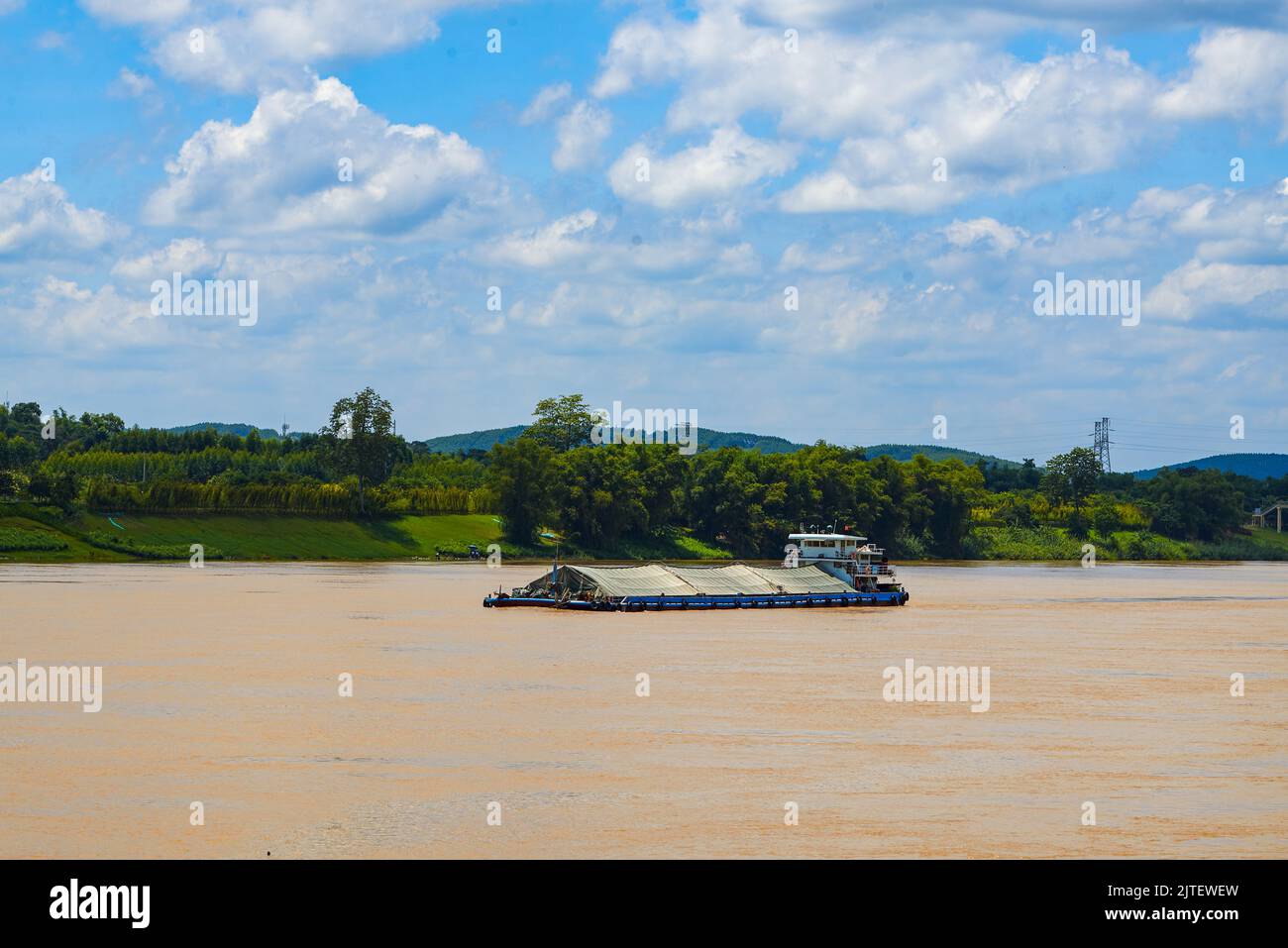 Large sand mining boat driving on the river outdoors Stock Photo - Alamy