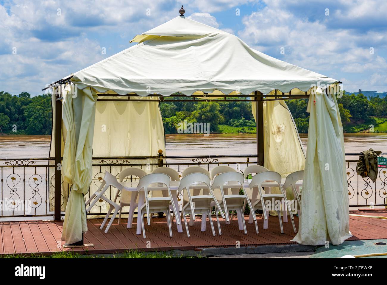 Dining table and chairs for outdoor riverside banquets Stock Photo - Alamy