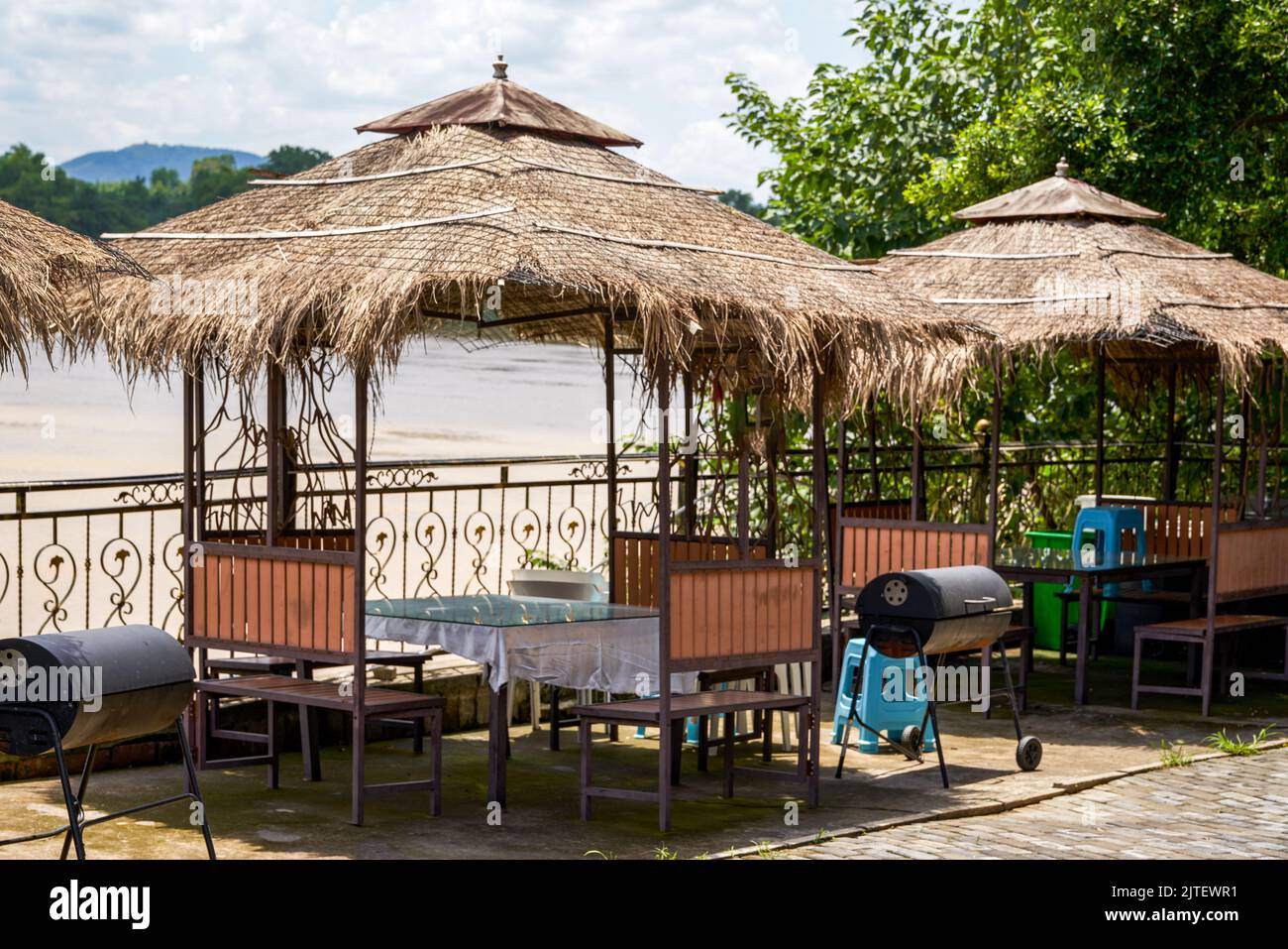 Dining table and chairs for outdoor riverside banquets Stock Photo - Alamy