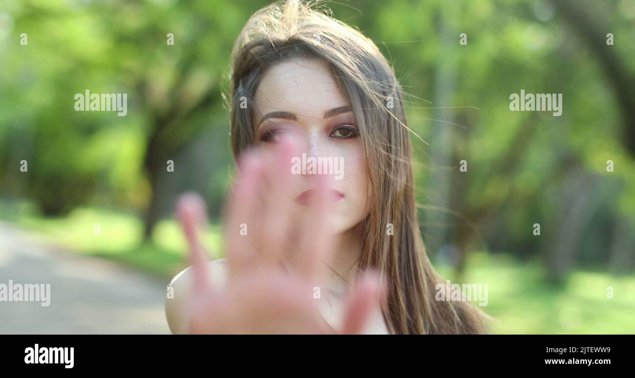 Millennial girl signalling to STOP with hand, woman waving finger ...
