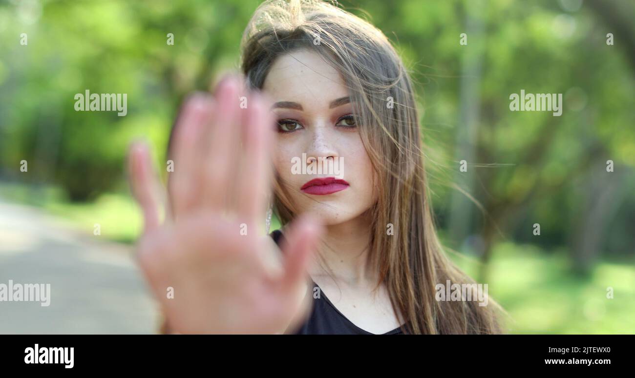 Millennial girl signalling to STOP with hand, woman waving finger ...