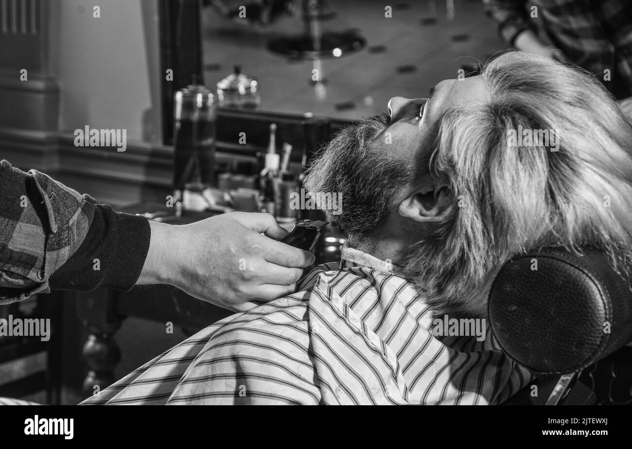 Maintaining beard shape. Grow beard and mustache. Man at barbershop ...