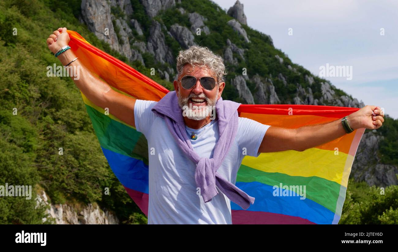 Portrait of a gray-haired senior elderly Caucasian man bisexuality with ...