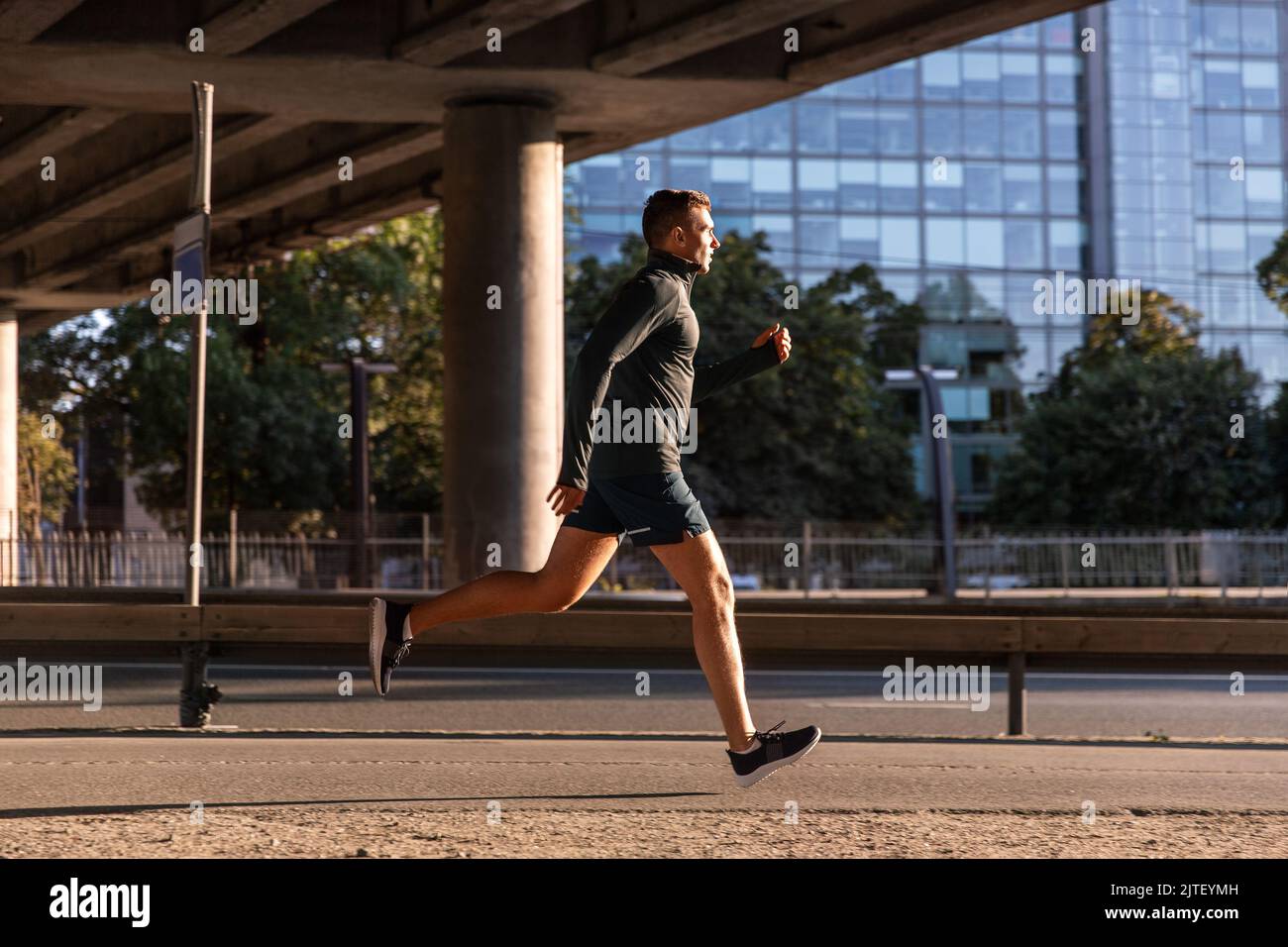 Man running under bridge hi-res stock photography and images - Alamy