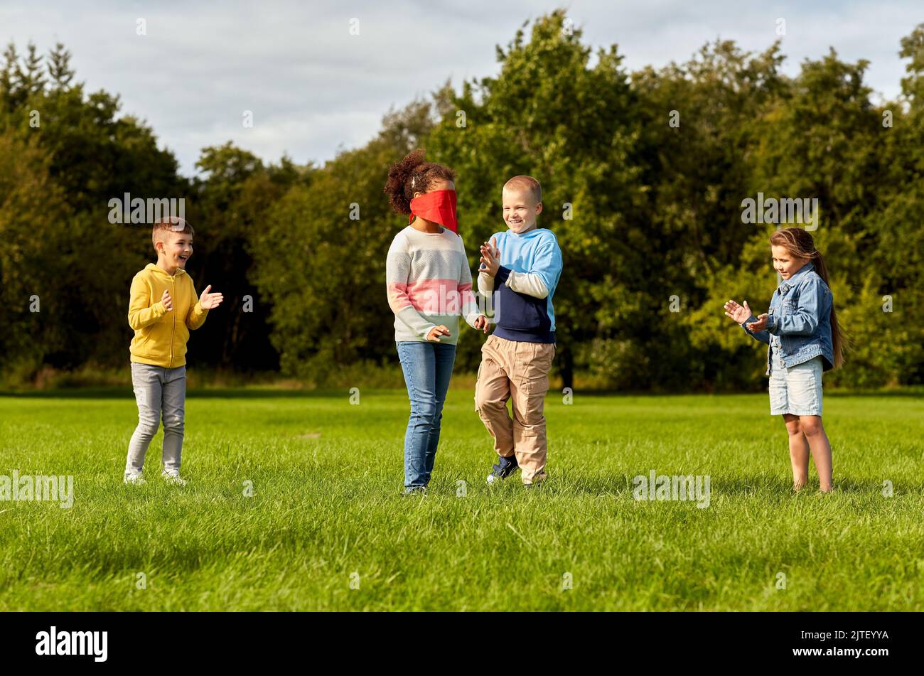 happy children playing and running at park Stock Photo - Alamy