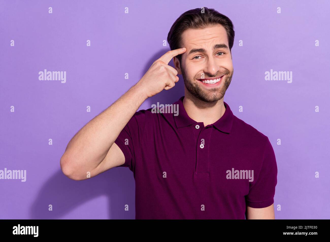 Photo of good young brunet guy show head wear purple polo isolated on ...