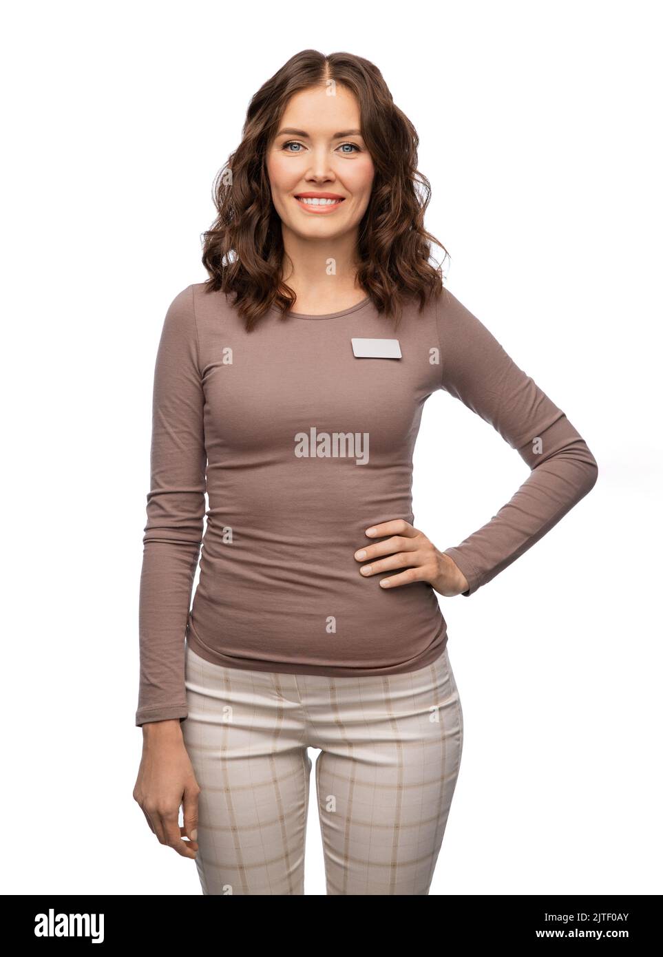 happy female shop assistant with name tag Stock Photo - Alamy