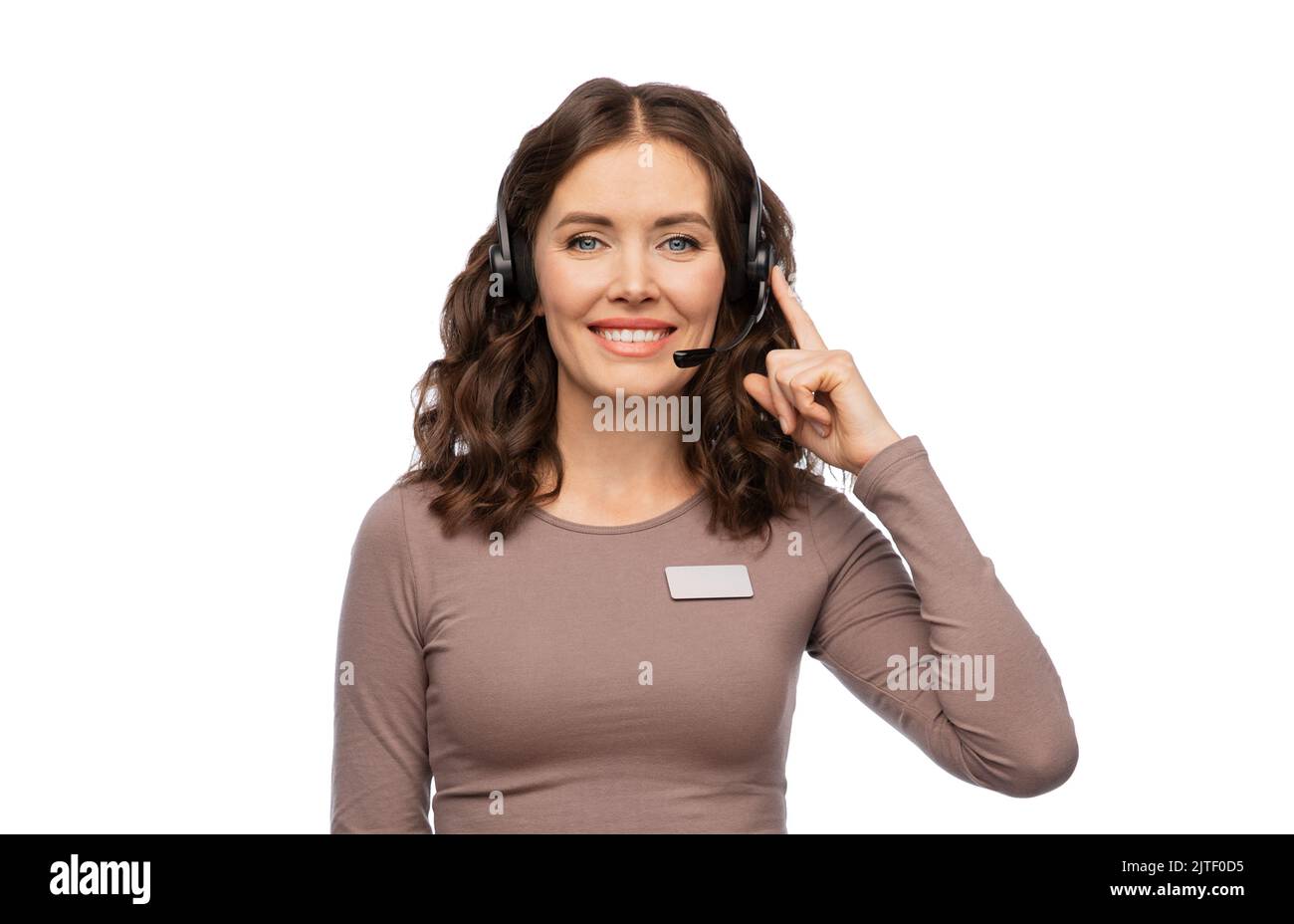 female helpline operator with headset and name tag Stock Photo - Alamy
