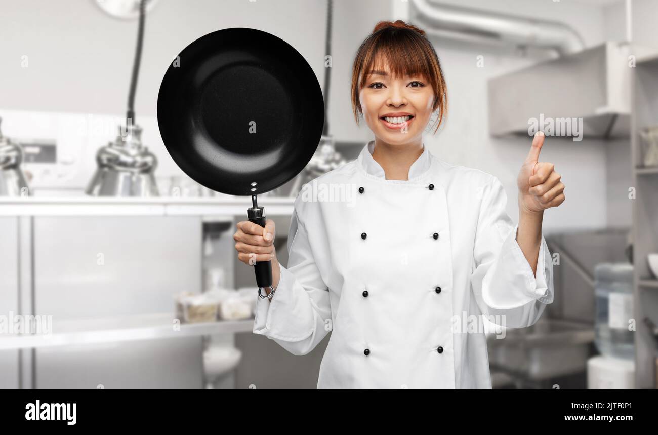chef with frying pan showing thumbs up on kitchen Stock Photo - Alamy
