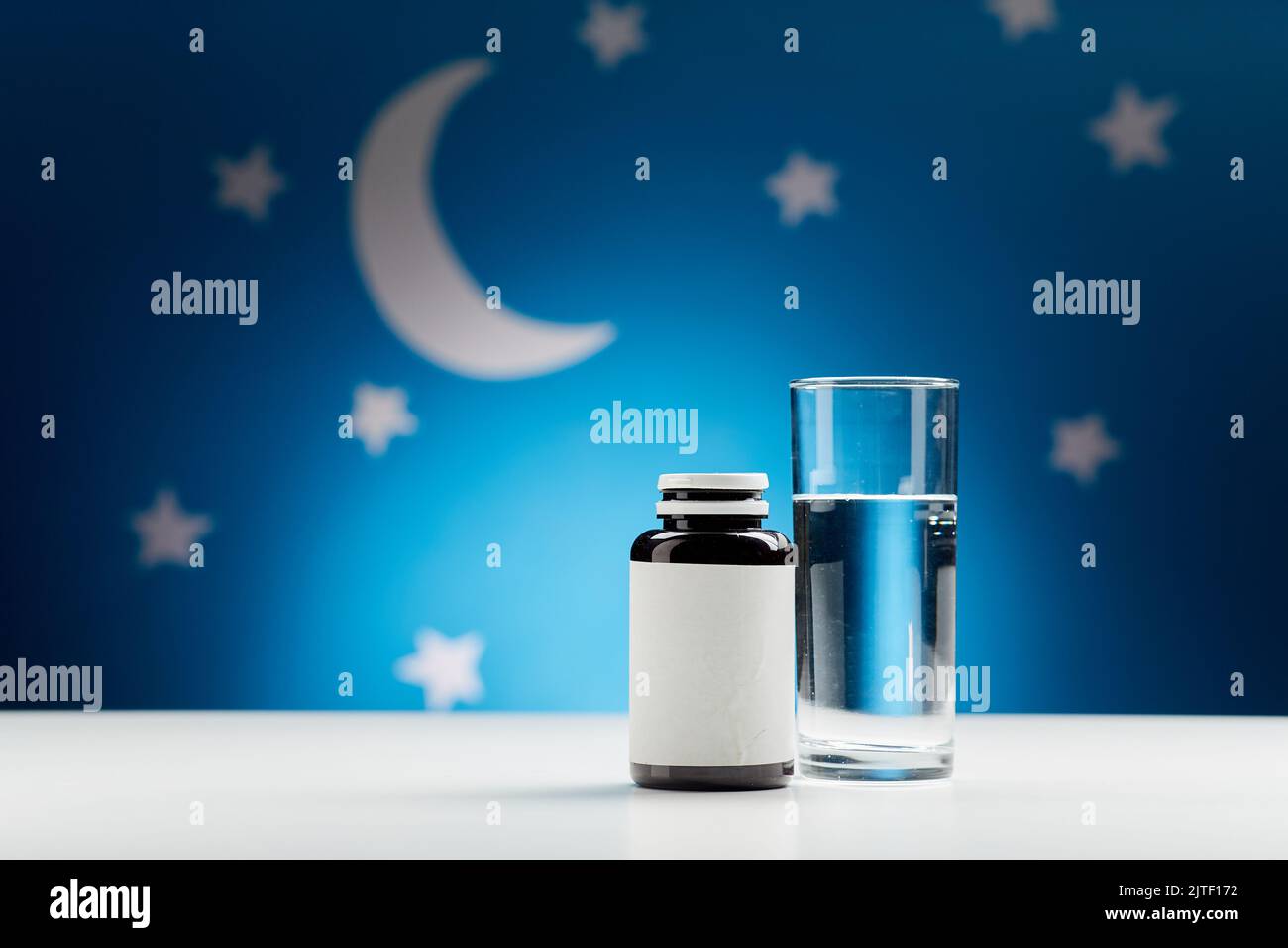 glass of water and soporific medicine at night Stock Photo - Alamy