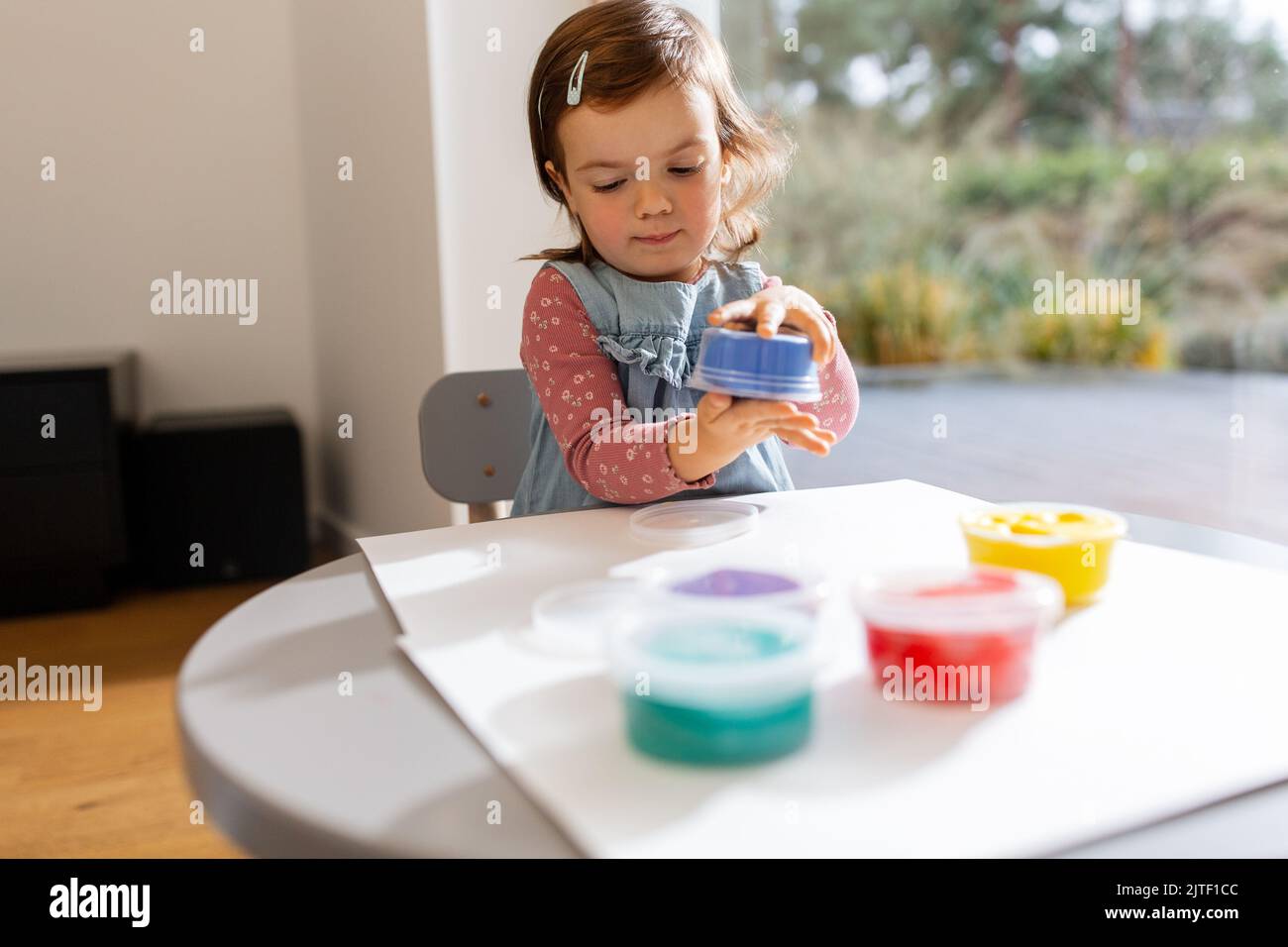 Girl playing modeling clay hi-res stock photography and images - Alamy