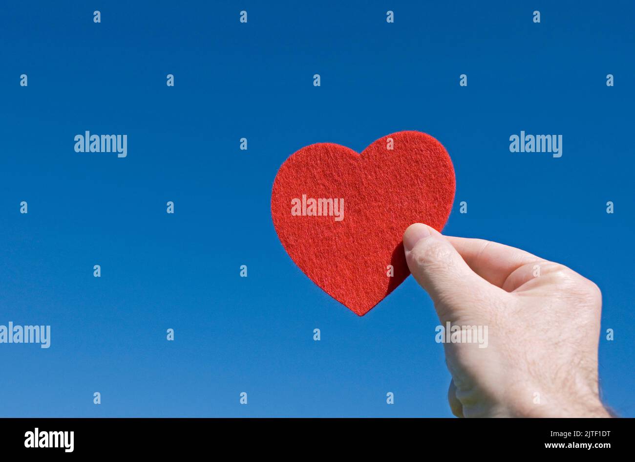 Hand holding heart sky hi-res stock photography and images - Alamy