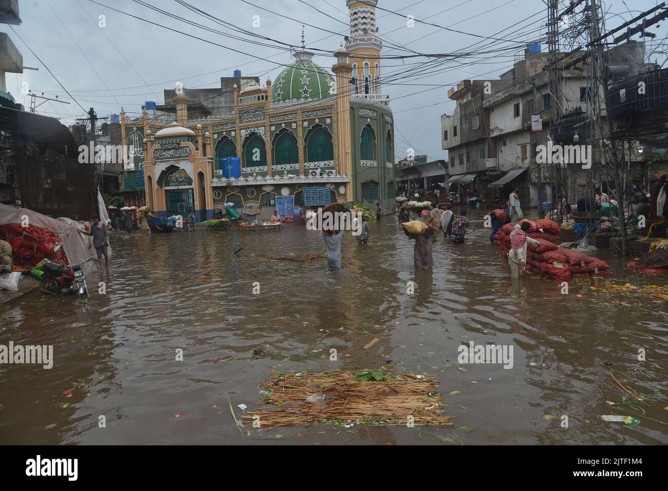 Lahore, Pakistan, August 29, 2022. Pakistani people on their way and busy in Badami bagh ...