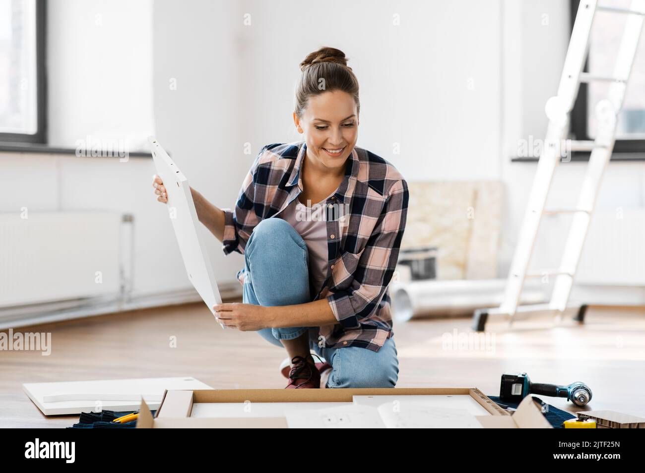 woman with manual assembling new furniture at home Stock Photo - Alamy