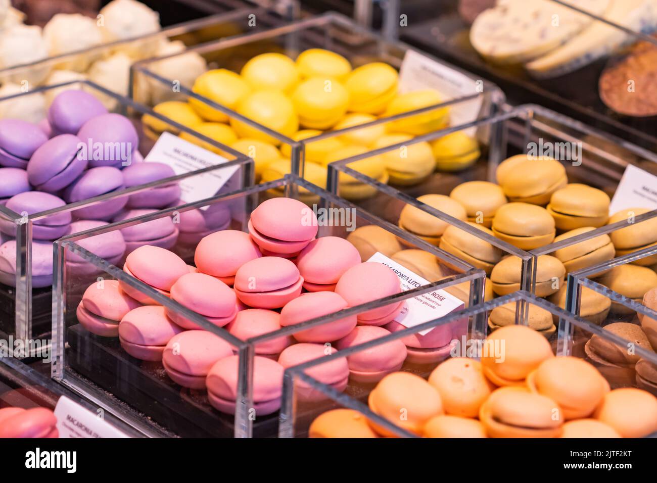Different types of colorful macarons in the candy store at the Boqueria ...