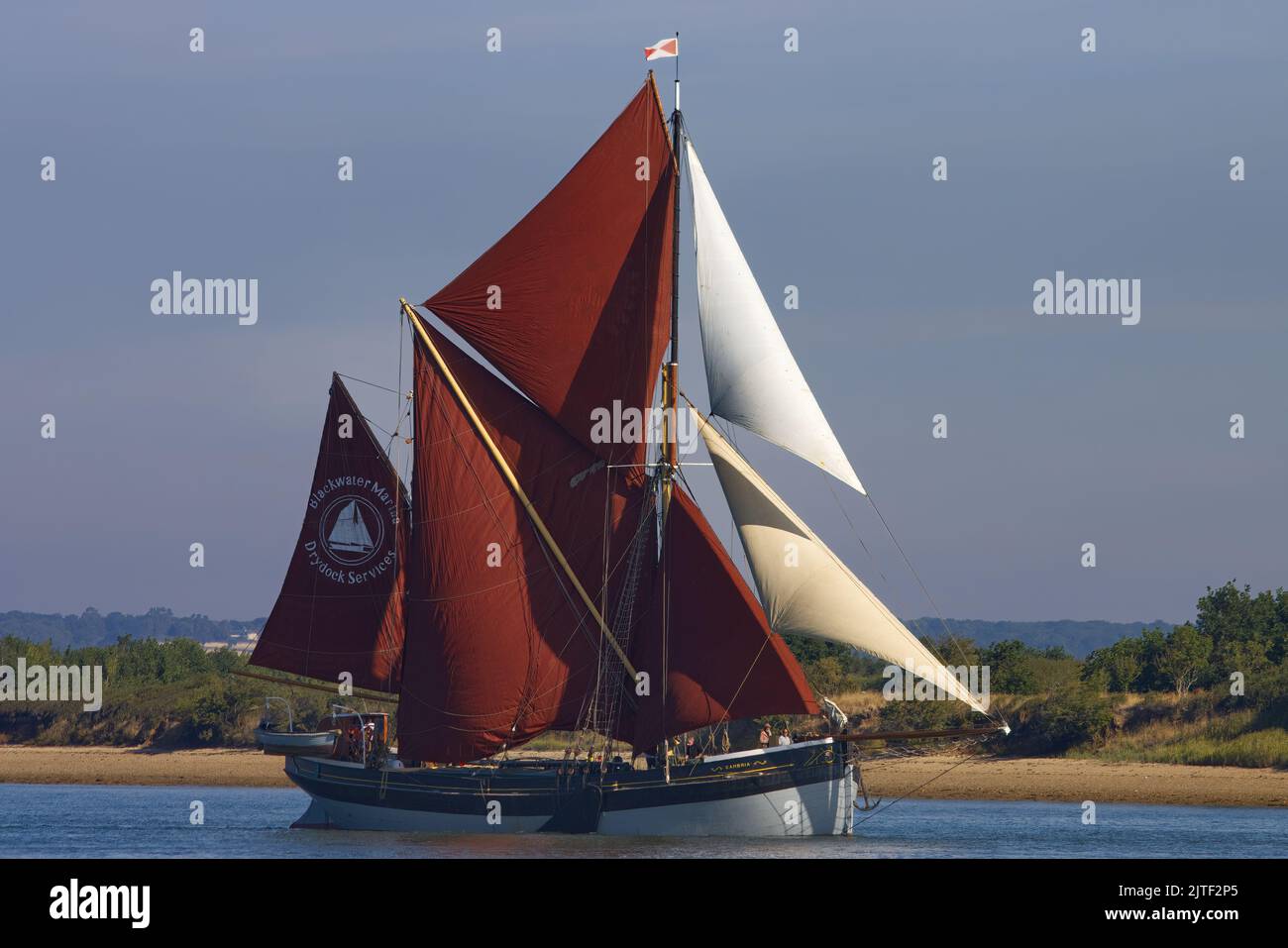 The Thames sailing barge Cambria in full sail on the river Blackwater ...