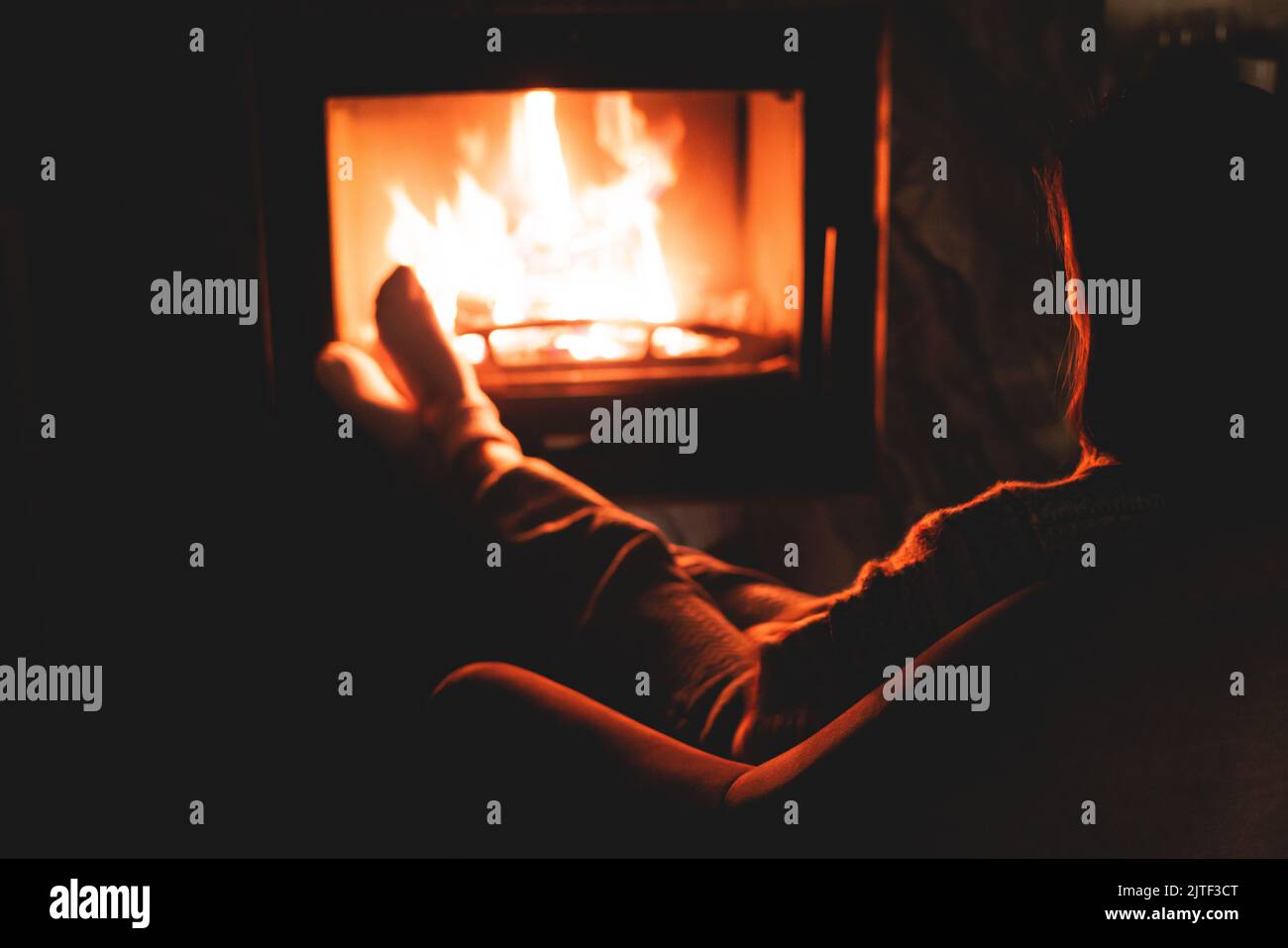 Cozy night in the cabin by the fireplace, fireplace burns in the ...