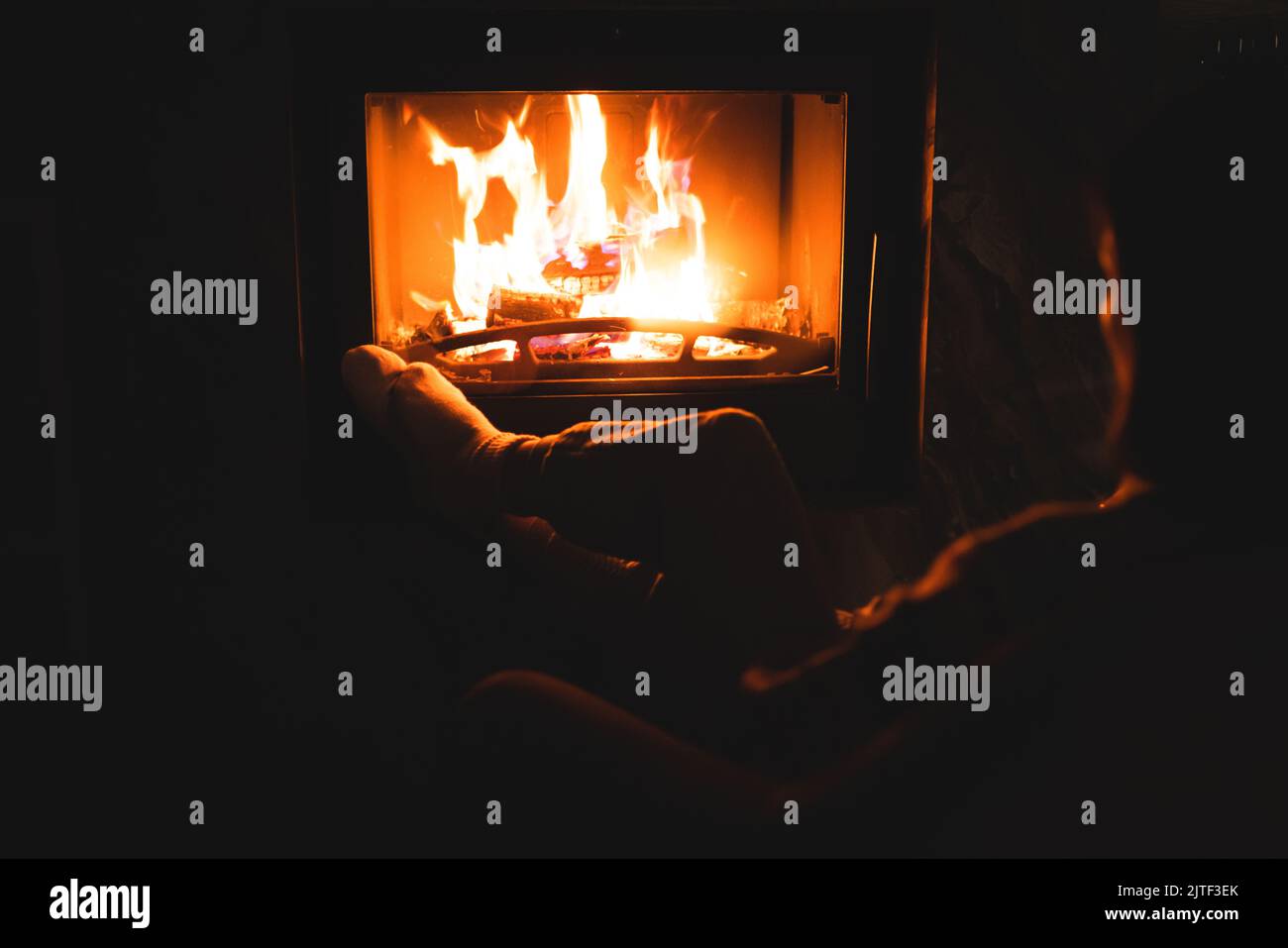 Cozy night in the cabin by the fireplace, fireplace burns in the ...