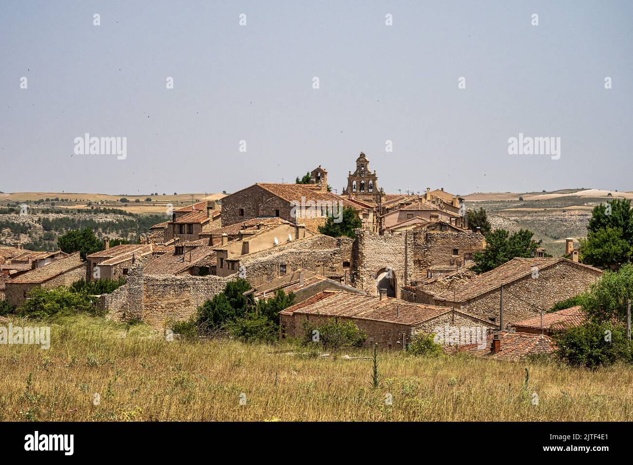 Medieval village with stone houses, cobblestone streets, old doors and ...